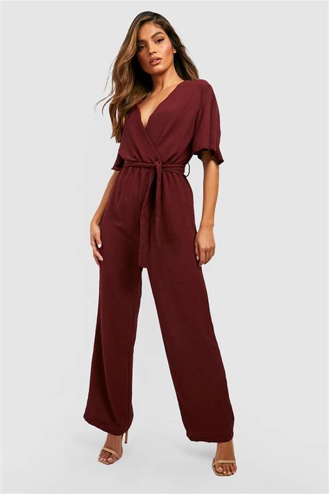 Womens Belted Wrap Over Jumpsuit Boohoo Uk