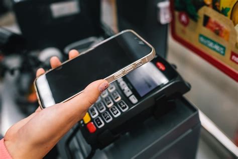 Premium Photo Making Mobile Payments From Pos Device Via Mobile Phone
