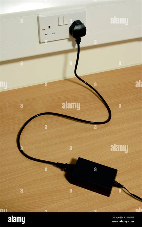 Power Cord Plugged Into Mains Socket Stock Photo Alamy