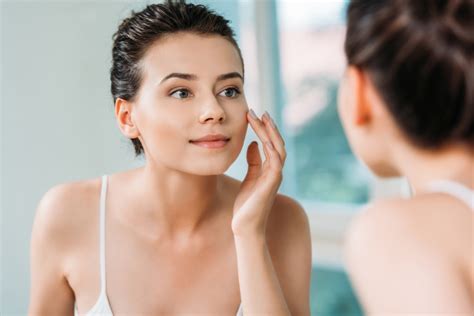 Woman Touching Face Beauty Myths