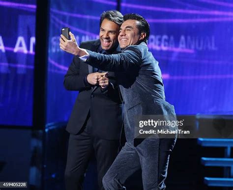 Eugenio Derbez And Actor Adrian Uribe Pose For A Selfie Photo Onstage