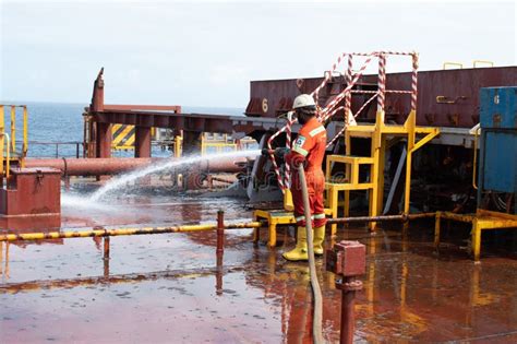 Ship S Crew Hosing Down At Cross Deck Of A Cape Size Bulk Carrier For