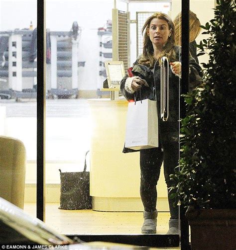 Heavily Pregnant Coleen Rooney Braves The Rain To Visit Hair Salon