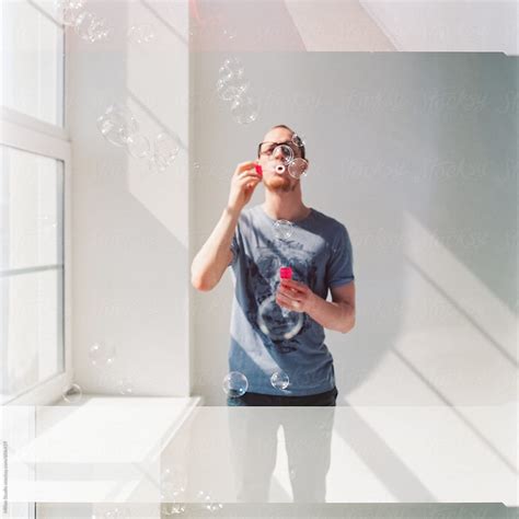 Man And Bubbles Del Colaborador De Stocksy Milles Studio Stocksy