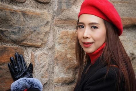 Premium Photo Portrait Of Woman Against Stone Wall
