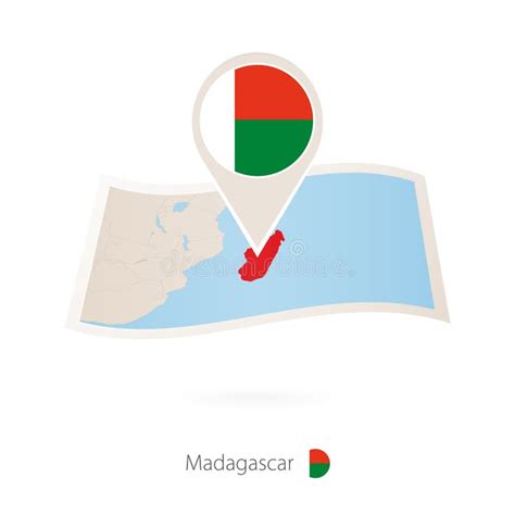 Mapa Doblado Del Papel De Madagascar Con El Perno De La Bandera De