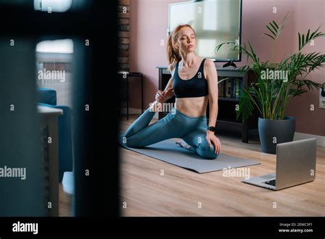 Flexible Redhead Young Woman Working Out Doing Stretching Exercise On