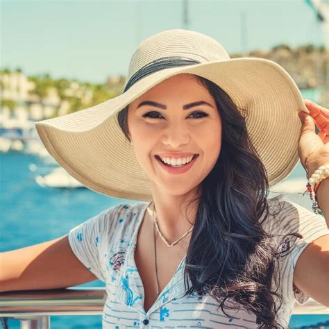 A Woman Wearing A Hat That Says Quot She Is Smiling Quot Premium Ai