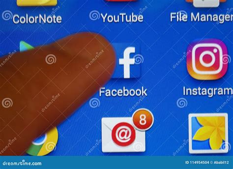 A Close Up Photo Of Apple Iphone Start Screen With â€˜facebook` Apps