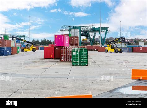 A Top Loader Vehicle Moves And Stacks Intermodal Shipping Containers At An Inland Container