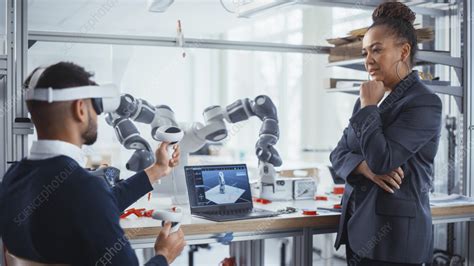 Engineers Using Virtual Reality Headset To Design Robotic Arm Stock Image F043 4238