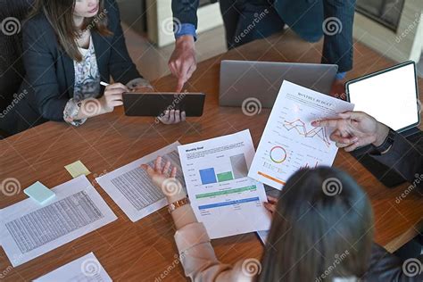 Executive Business People Brainstorming And Analyzing Financial Reports