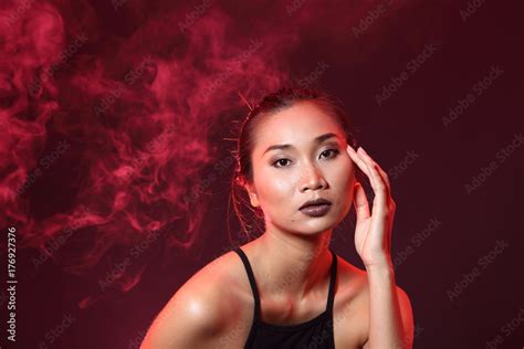 Smoke Tan Skin Asian Woman Black Hair Dark Lip With Dense Fluffy Puffs