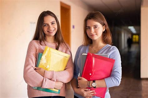 Education Concept Two Girls Going To Classes Pretty Person Folder Photo