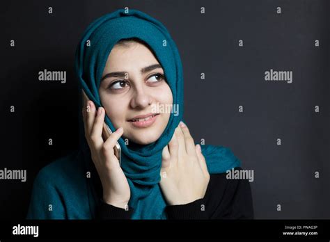 Muslim Smiling Girl Talking On A Cell Phone Happy Arab Woman In Hijab