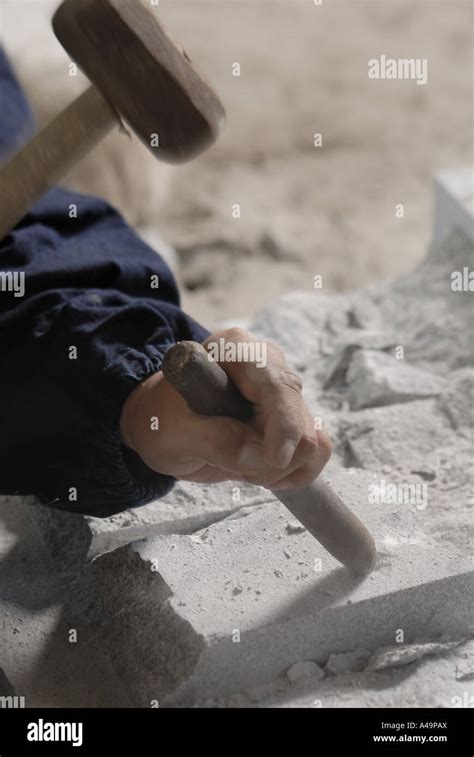 Close Up Of A Person S Hand Using A Chisel And A Hammer On A Stone Stock Photo Alamy