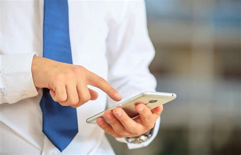 Premium Photo Businessman Holding A Smartphone
