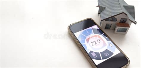 Controlling Home Heating Temperature With A Smart Home Close Up On Phone Concept Of A Smart