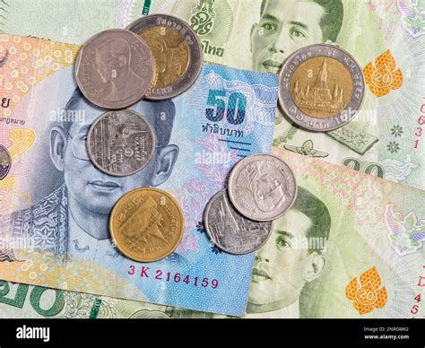 Macro Detail With A 50 Thai Baht Banknote And Different Coins The Baht
