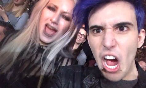 Two People With Blue Hair Posing For The Camera
