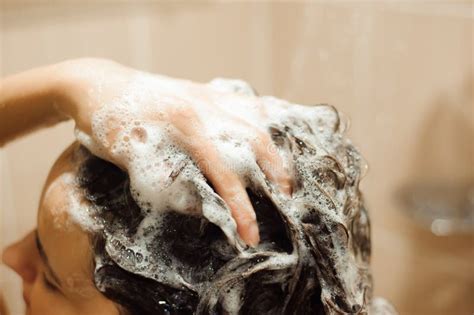Beautiful Naked Young Woman Smiling While Taking Shower In Bathroom
