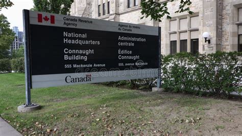The Headquarters Of The Canada Revenue Agency Sign And Building In