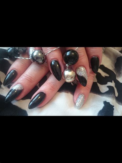 Stiletto Acrylic Nails With Black And Silver Glitter Artwork Nails