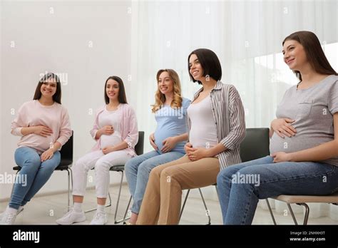 Group Of Pregnant Women At Courses For Expectant Mothers Indoors Stock
