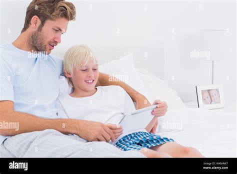 Father Son Using Touchscreen Tablet Hi Res Stock Photography And Images Alamy
