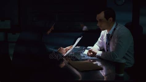 Criminal Handcuffs Interrogated Police Officer Being Shown Evidence