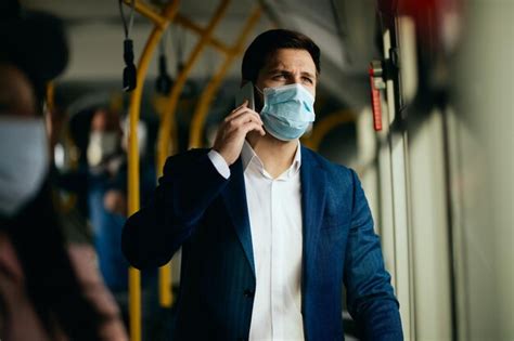 Free Photo Pensive Businessman With Protective Face Mask Making A