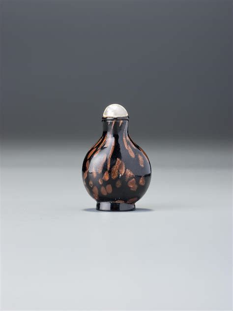 Bonhams A Dark Green And Deep Ruby Red Aventurine Glass Snuff Bottle