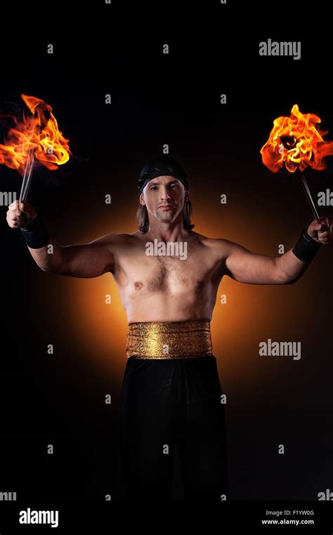 Handsome Men Holding Torches Stock Photo Alamy