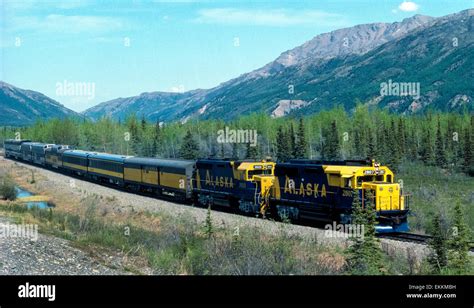 Two Blue And Yellow Locomotives Of The State Operated Alaska Railroad