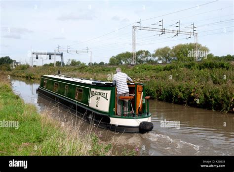 Narrowboat On The Oxford Canal Alongside The West Coast Main Line