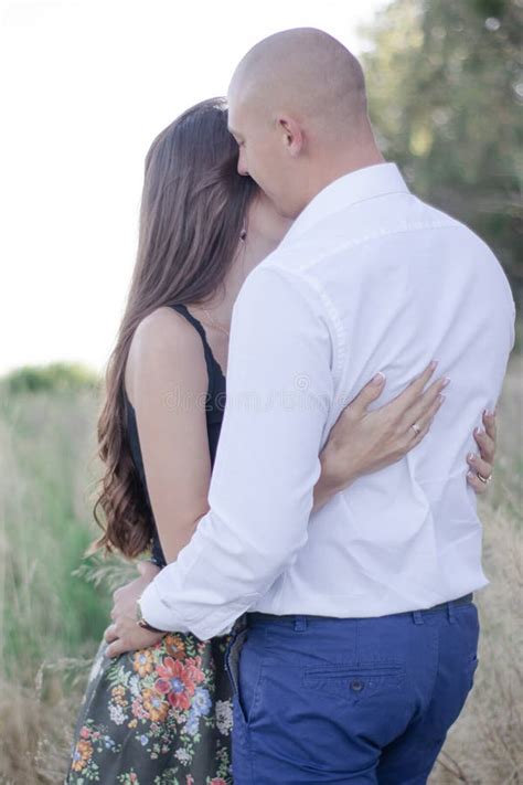 Happy Couple In Love Husband And Wife Brunette And Bald Man In The