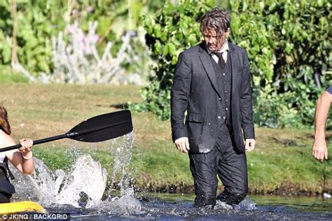 Johnny Depp Smokes As He Swims In A Suit With Swans Daily Mail Online