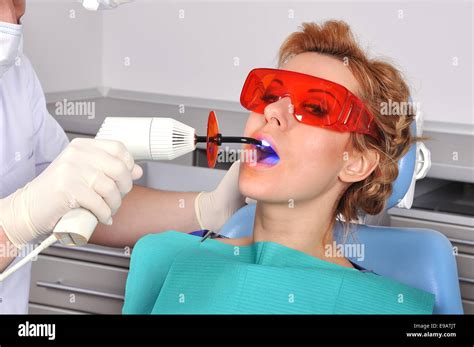 Girl Teeth Stopping Treatment With Dental Curing Ultraviolet Light