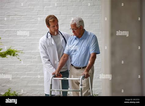 Remember To Take It Slow A Male Doctor Supporting His Senior Patient
