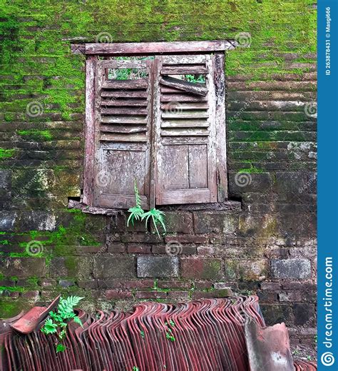 Window In A House That Has Been Fragile Abandoned By Its Inhabitants
