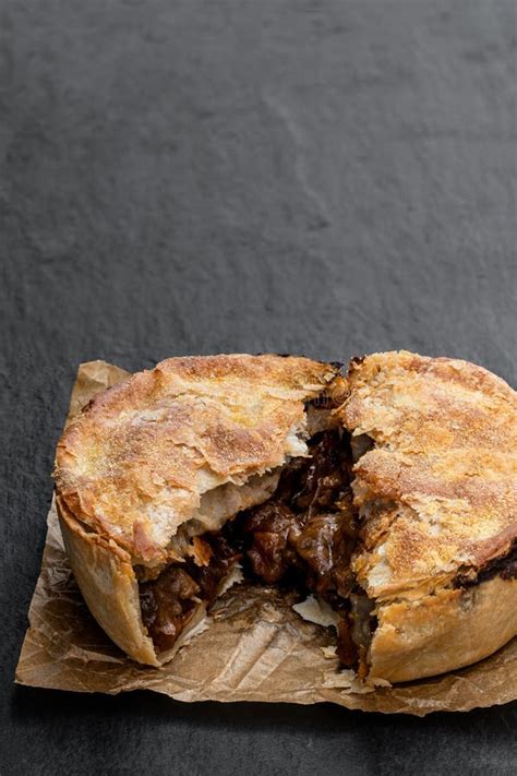 Puff Pastry Steak Pie On Baking Paper On Stone Background Stock Image