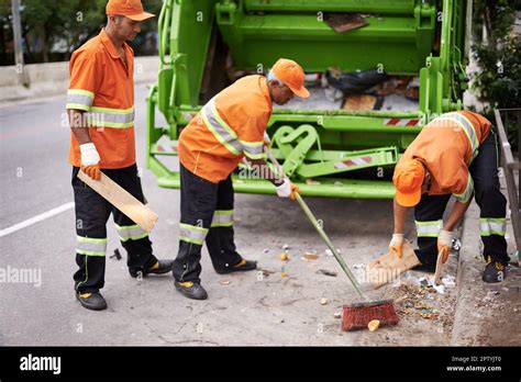 Garbage Collection Day A Garbage Collection Team At Work Stock Photo