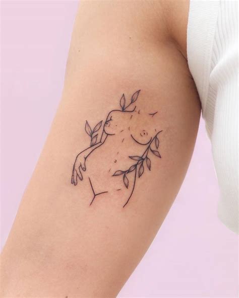 Leaves And Nude Woman Tattoo Located On The Inner Arm