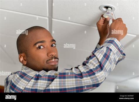 Replacing A Light Bulb Stock Photo Alamy