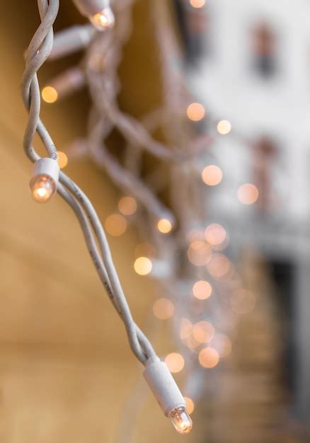Premium Photo Close Up Of Illuminated Lighting Equipment Hanging On Metal