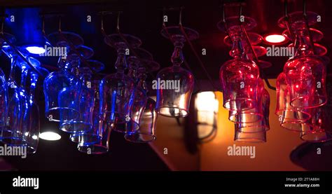 French Bar Empty Upside Down Wine Glasses Hanging From The Bar In A