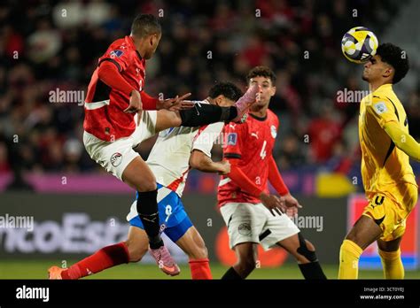 Egypts Goalkeeper Ahmed Wahp Right Blocks A Header By Chiles Juan