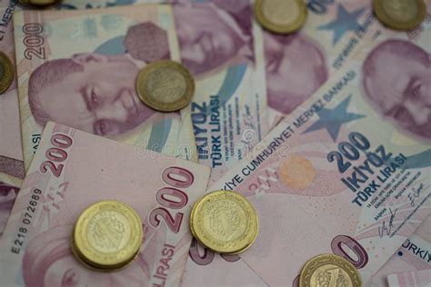 Shining Golden Coins Placed On Hundred Turkish Lira Banknotes Highlight