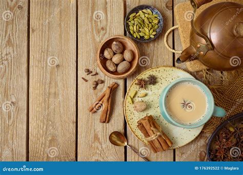 Masala Chai Tea Traditional Indian Drink With Milk And Spices On Wooden