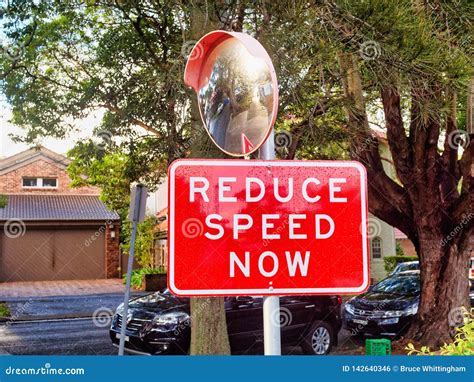 Reduce Speed Sign And Safety Mirror Editorial Photo Image Of Suburban